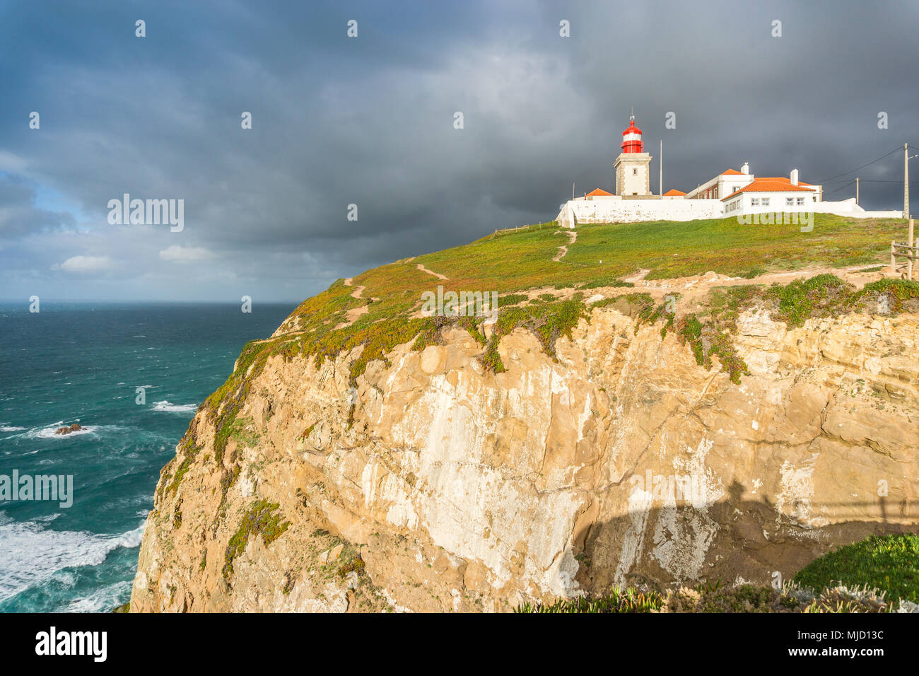 Dark clouds above lighthouse on the cliffs on Cape Roca - Cabo da Roca ...