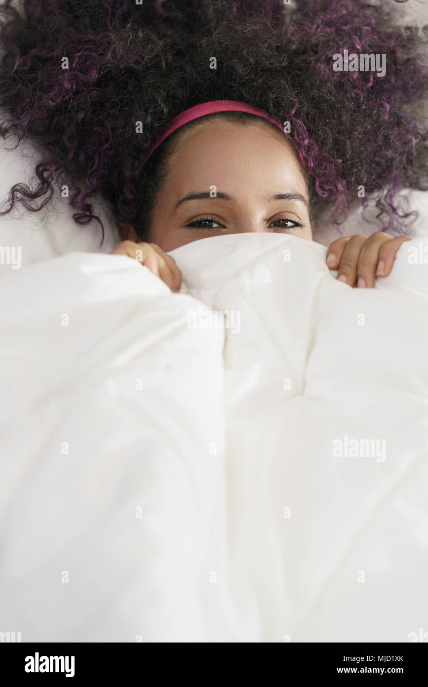 African american woman waking up in bed hi-res stock photography and ...