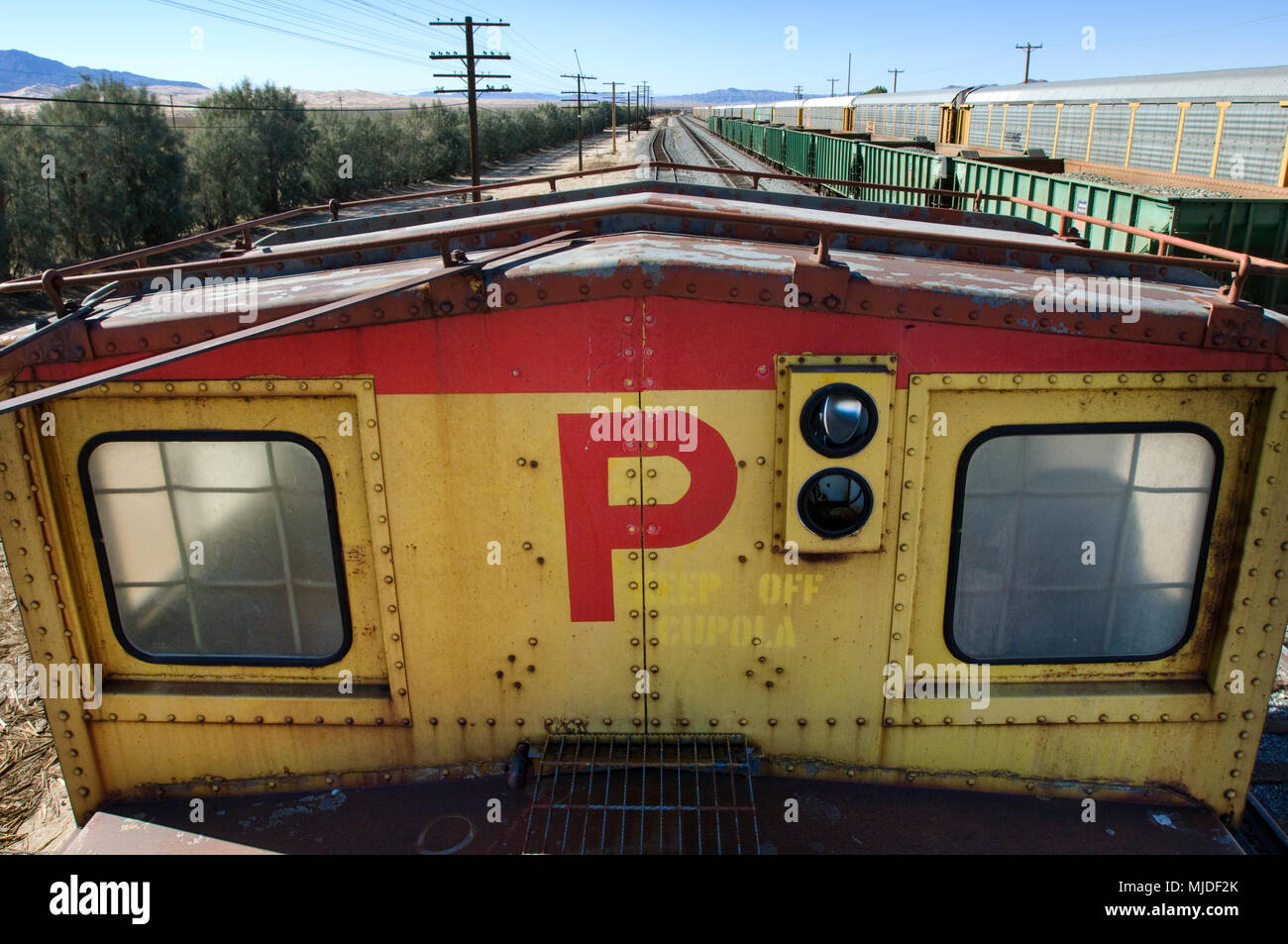 A view of railroad tracks from a train roof Stock Photo - Alamy