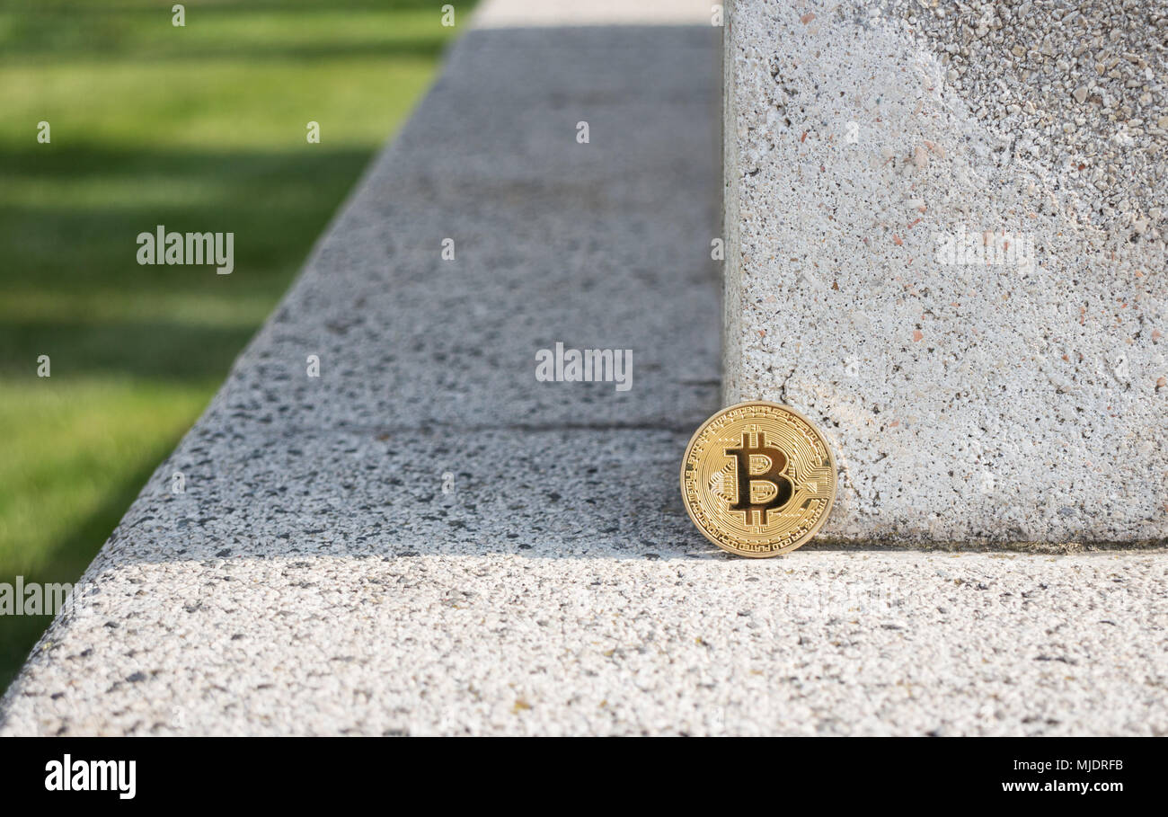 Physical copper Bitcoin on concrete stone wall Stock Photo - Alamy