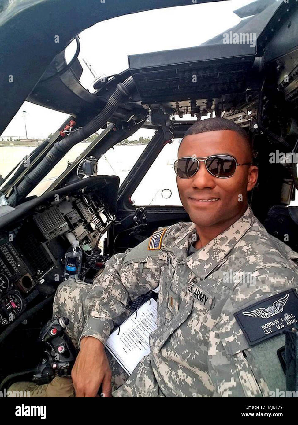 Idaho Army National Guard 2nd Lt. Morgan Hill sits inside a UH-60L ...