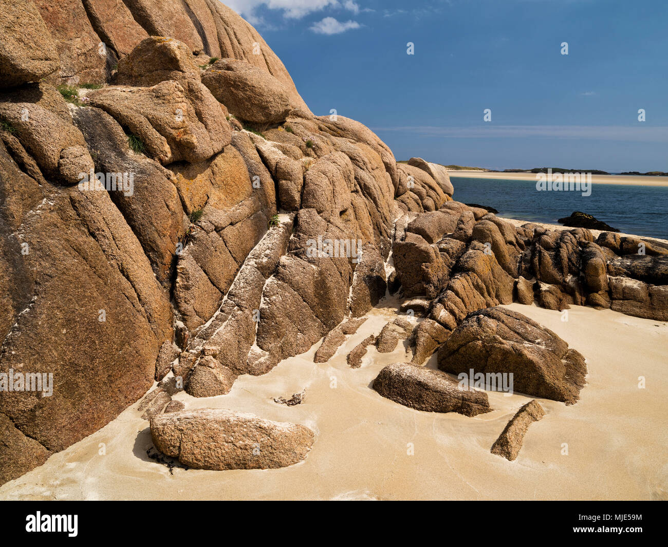 Ireland, Donegal, sandy beach and pink-coloured granite rocks at the ...