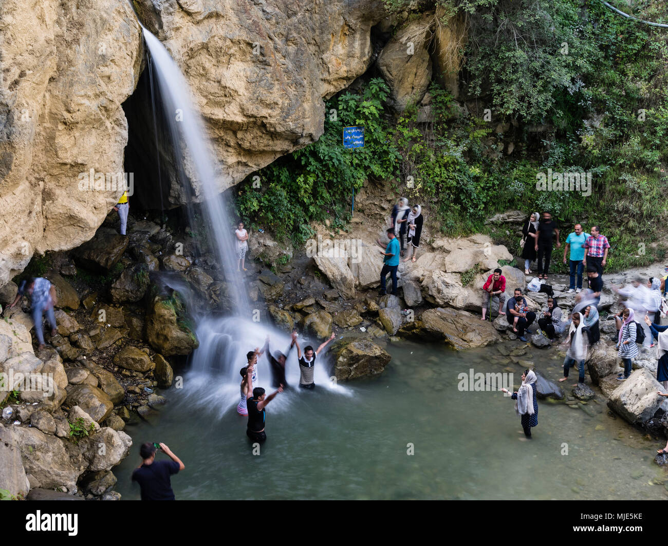 Woman under waterfall hi-res stock photography and images - Alamy