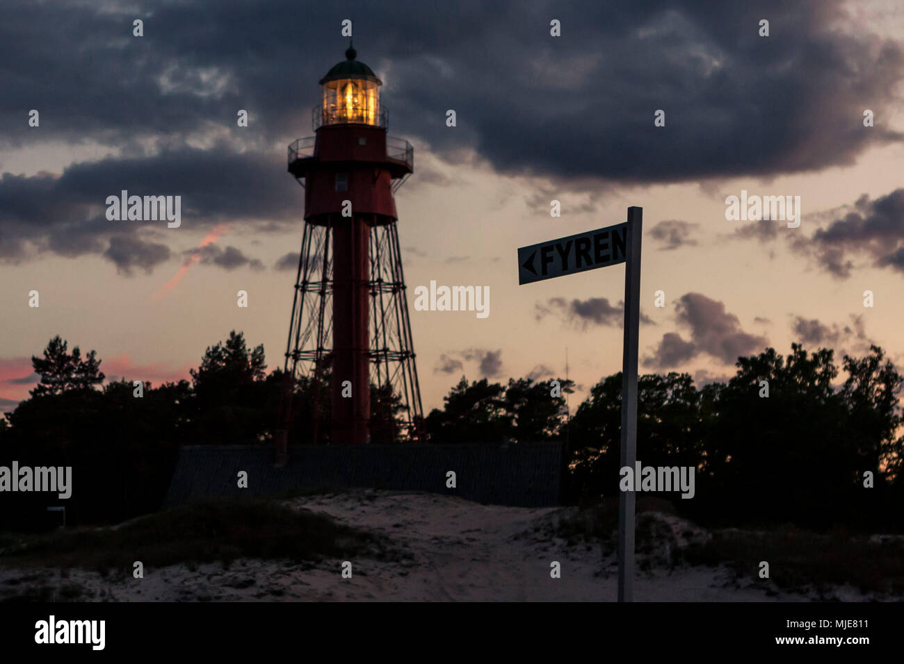 Lighthouse at dusk Stock Photo - Alamy
