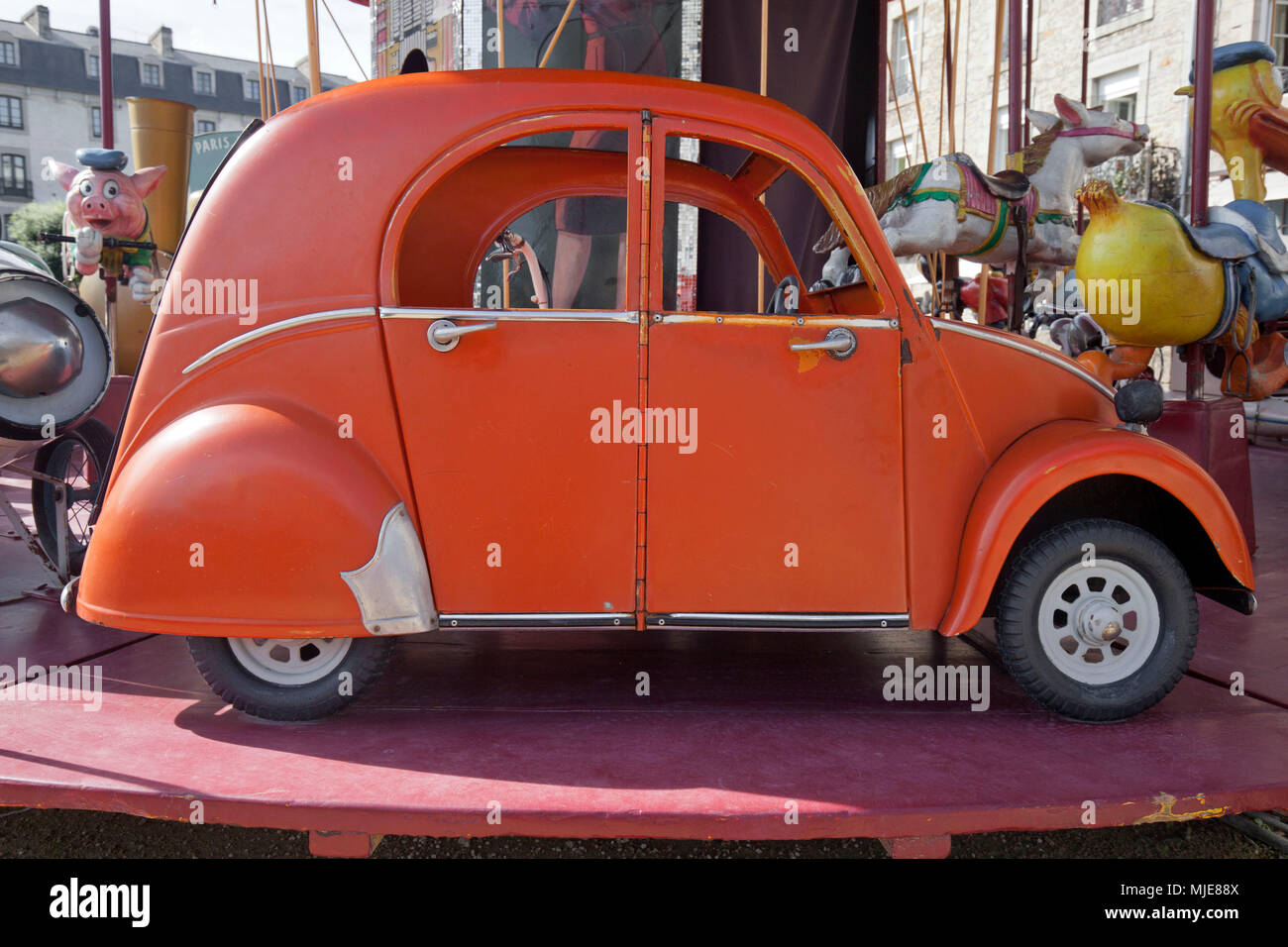 Car on children's merry-go-round Stock Photo - Alamy