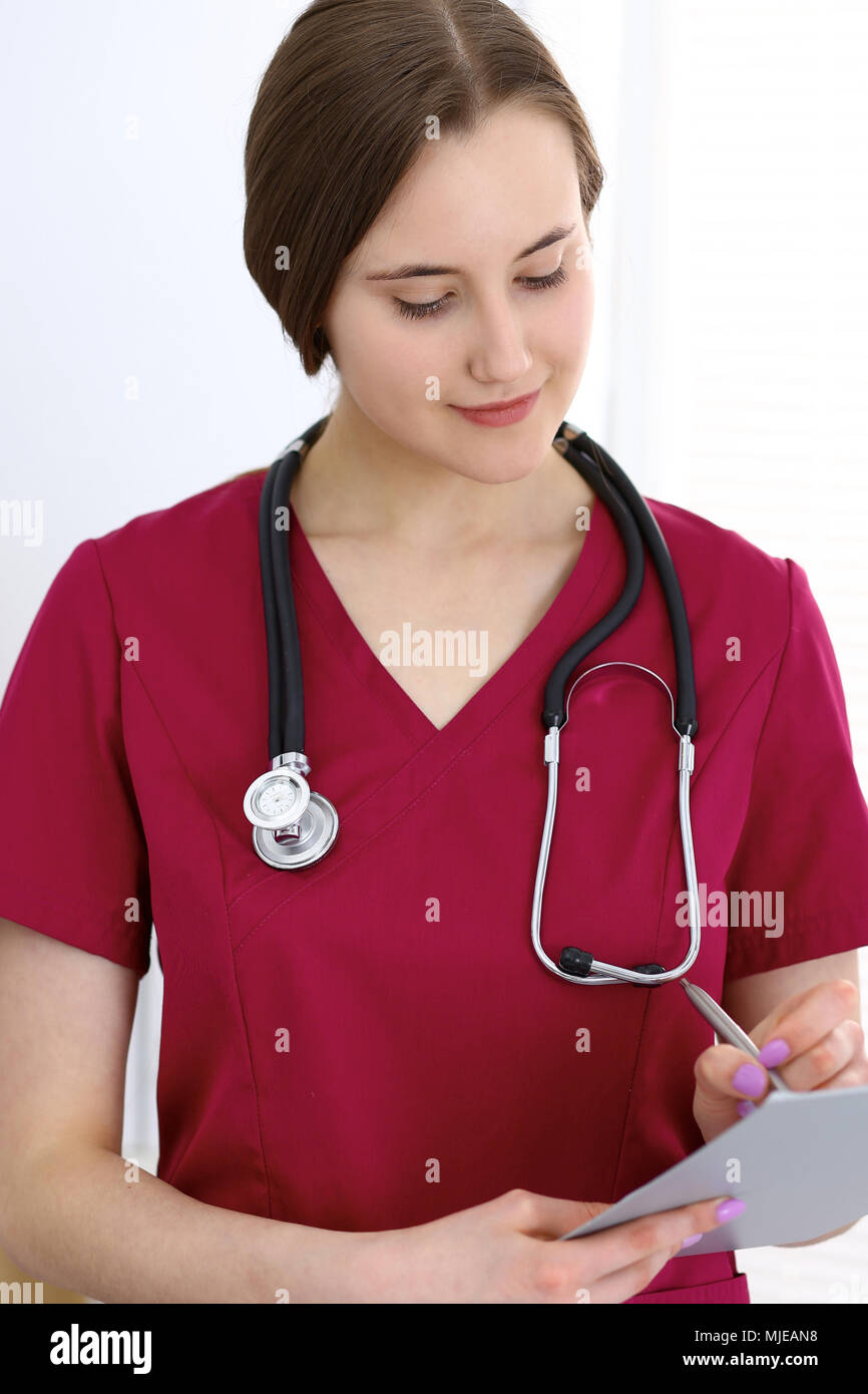 Woman doctor at work in hospital office. Medicine and health care ...