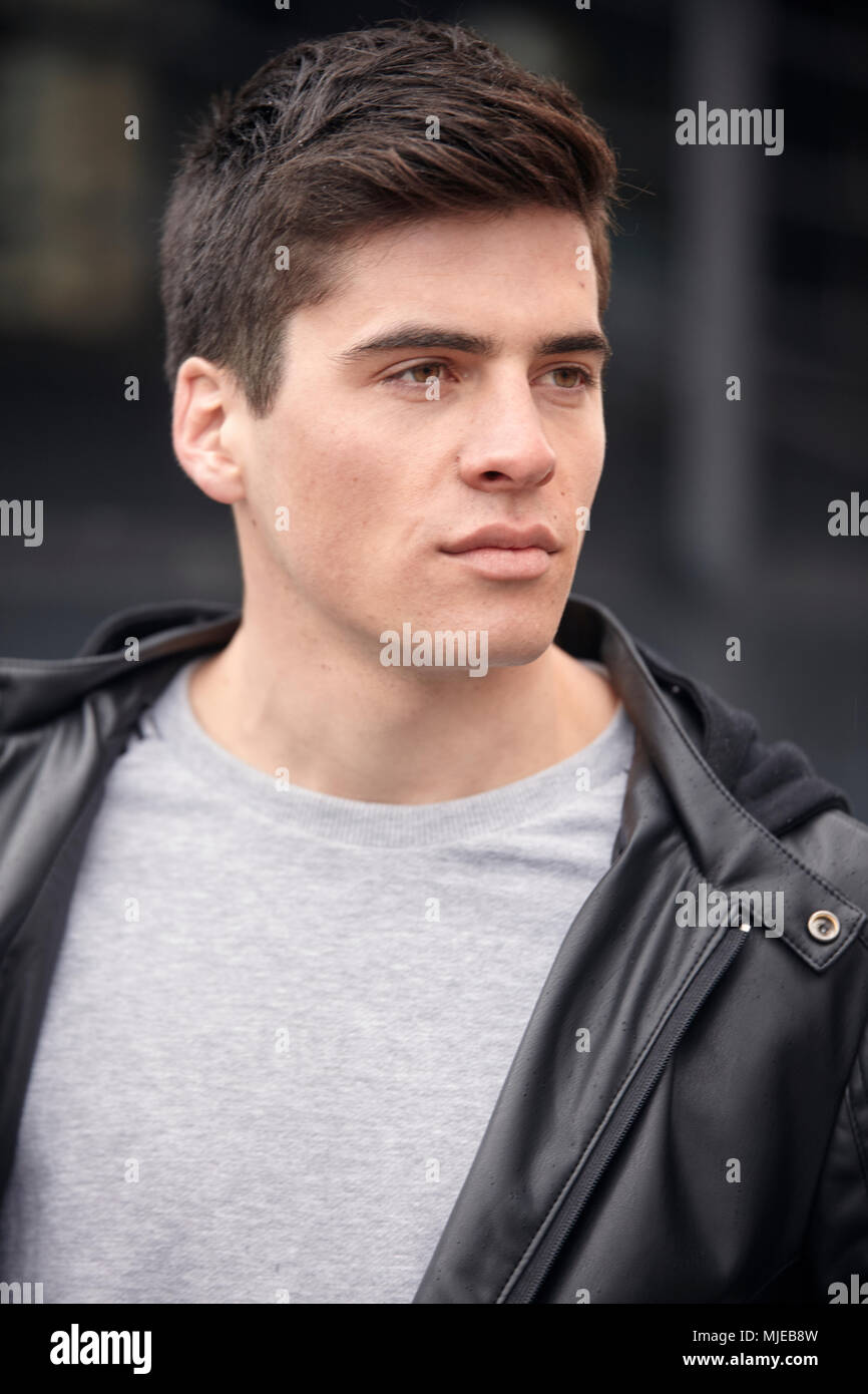 headshot, side view, handsome man outdoors, wearing jacket, casual ...