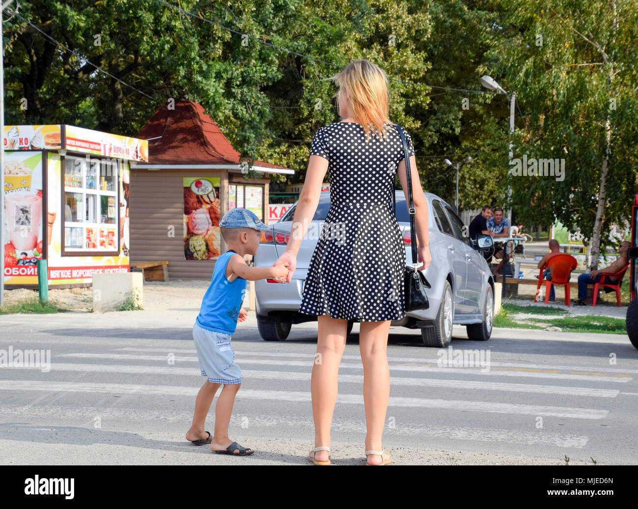 Krasnodar, Russia - August 28, 2017: Mother and son cross the road on a ...