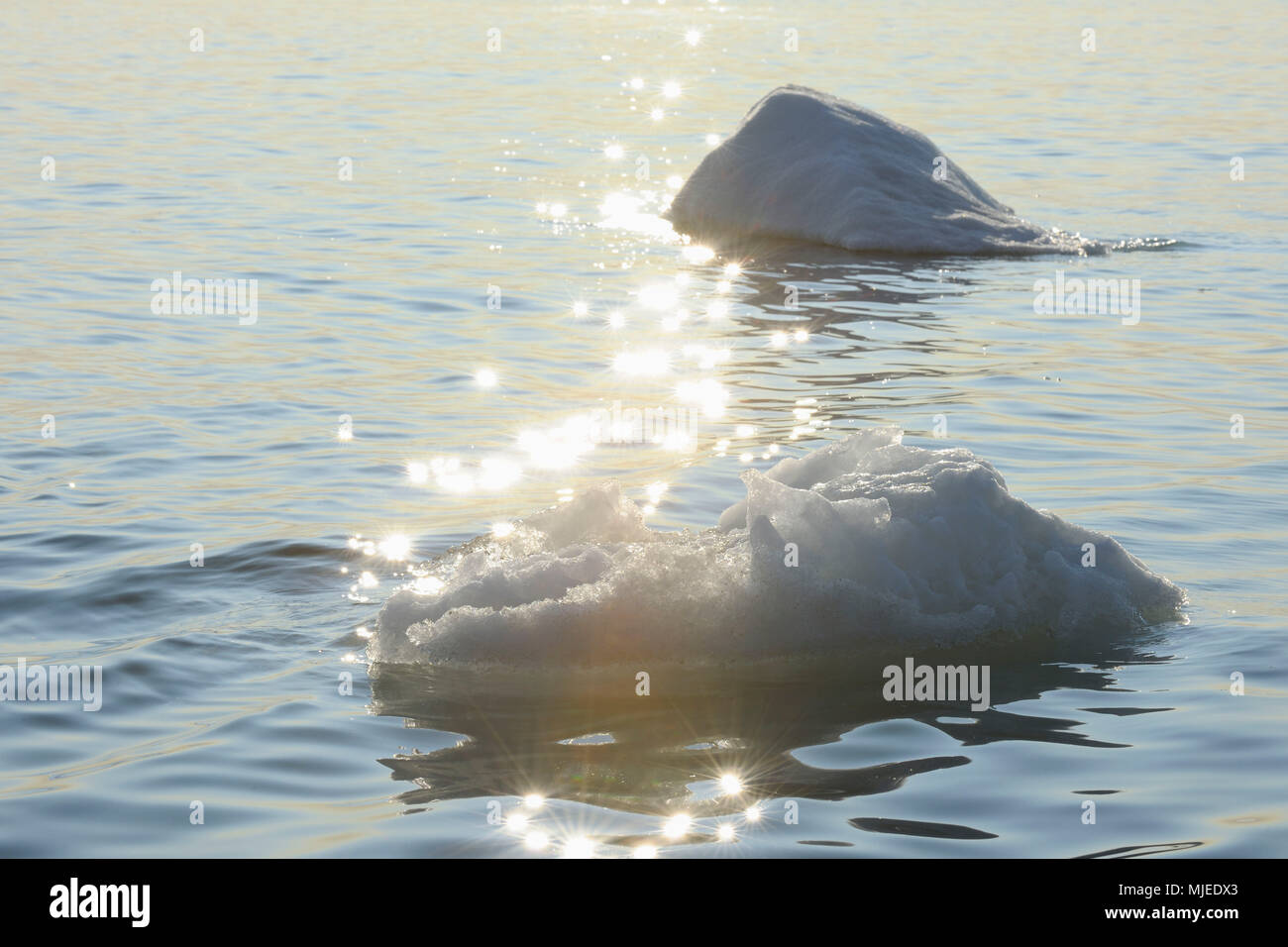 Ice floe at Ilulissat icefjord with sun, Ilulissat, Icefjord, Disko Bay ...