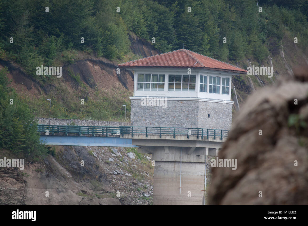 House at the dam to regulate water Stock Photo - Alamy