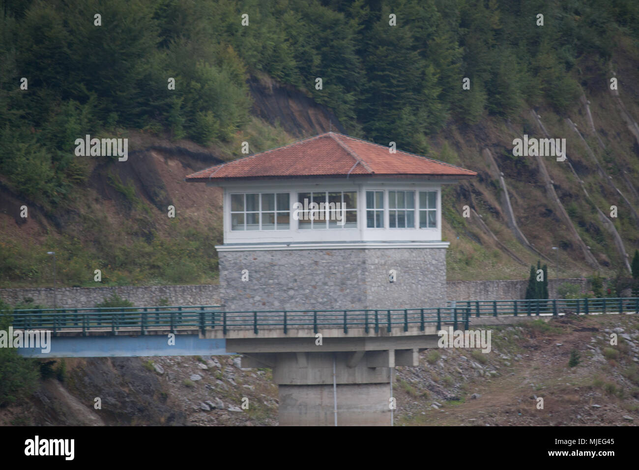 House at the dam to regulate water Stock Photo - Alamy