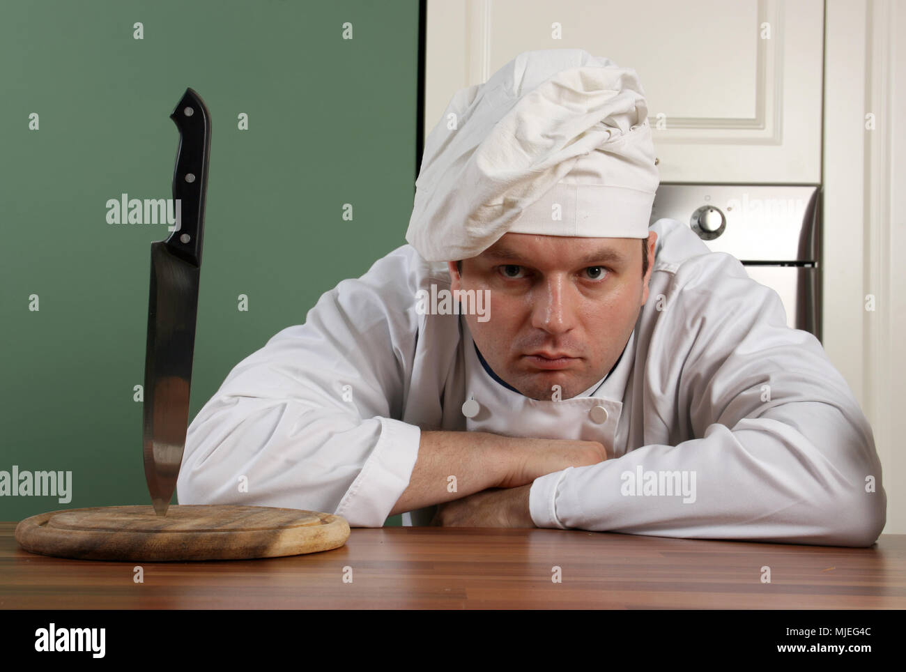 Chef with cap look at you with horror look and wait yours order Stock ...