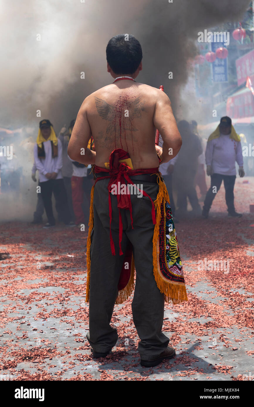 Beigang, Taiwan, May 4, 2018: A spirit medium with a bloody back from ...