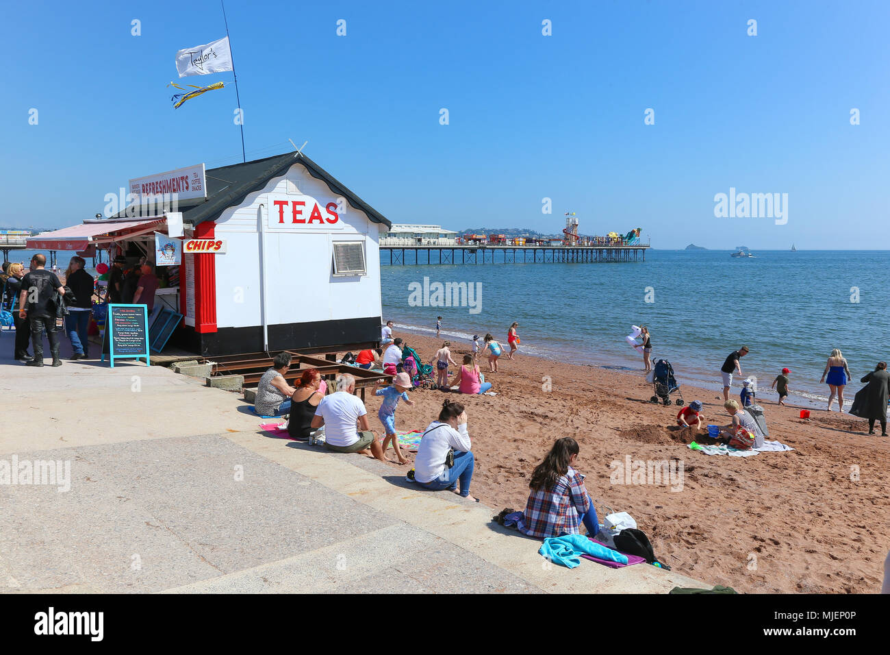 A queue for the tea hut on Paignton seafront Stock Photo - Alamy