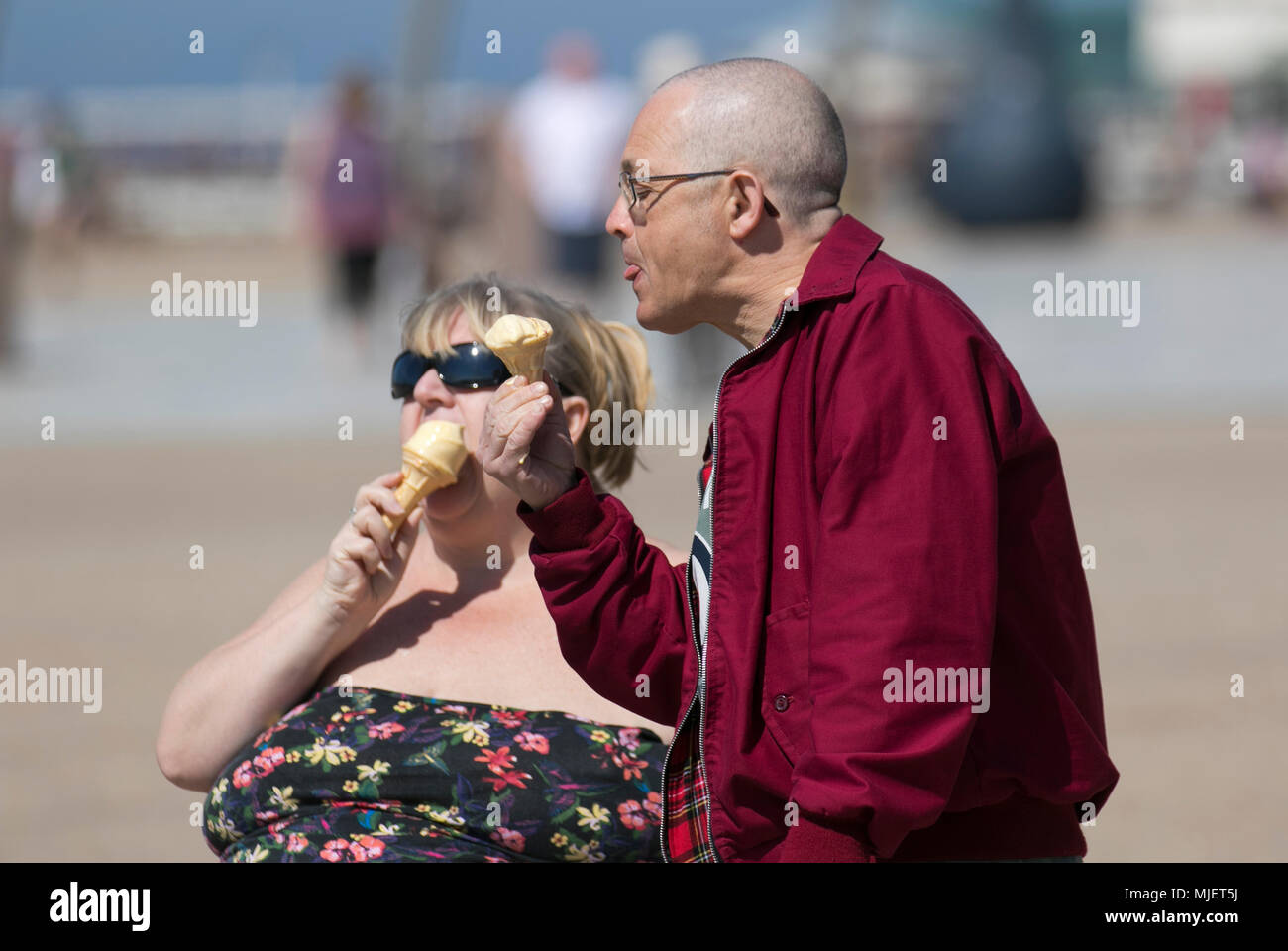 Woman eating ice cream fat hi-res stock photography and images - Alamy