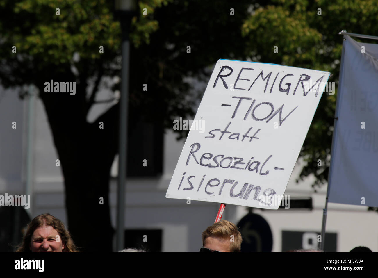 Kandel, Germany. 5th May 2018. A right-wing protesters carries a ...