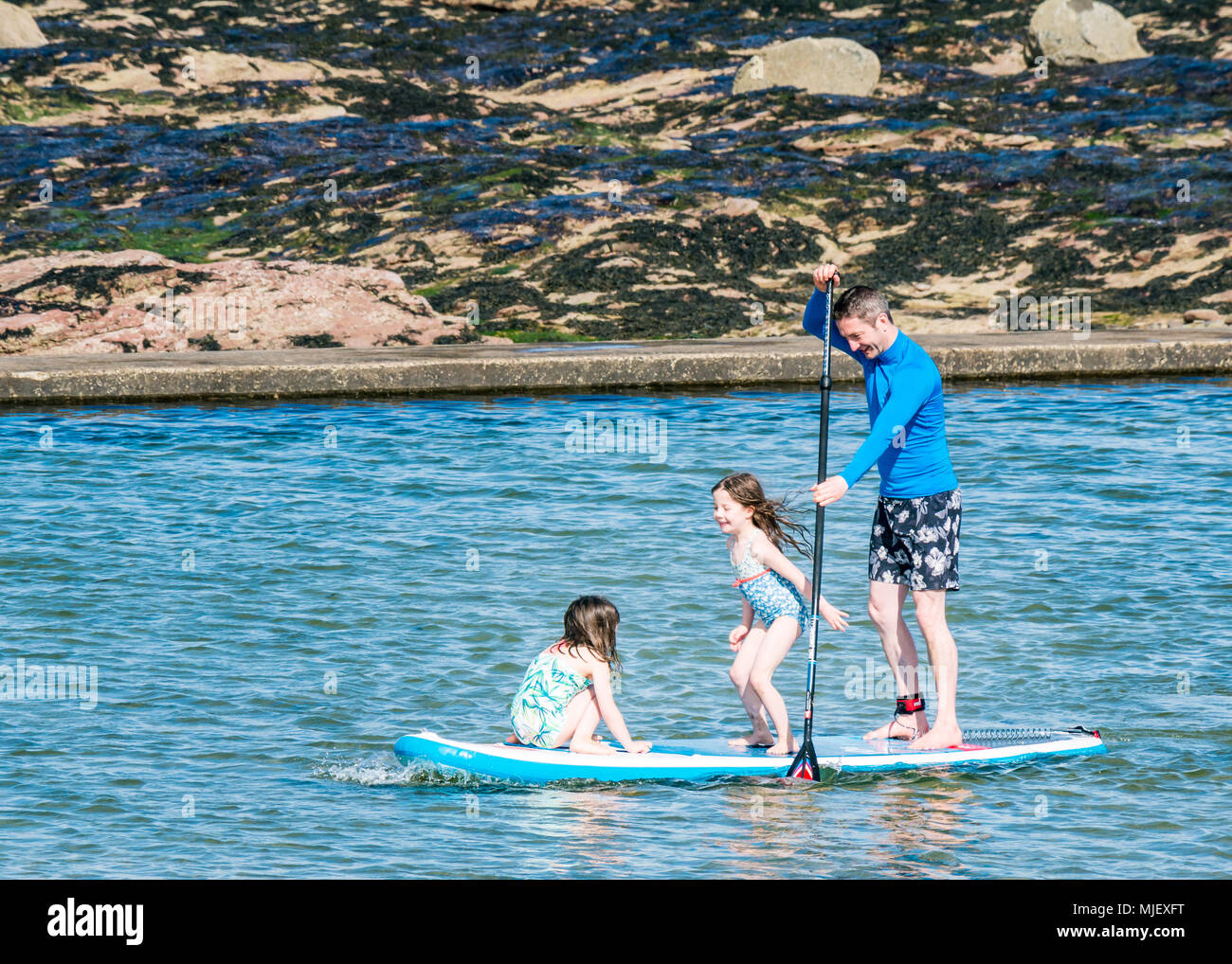 Girls on paddle boards hi-res stock photography and images - Alamy