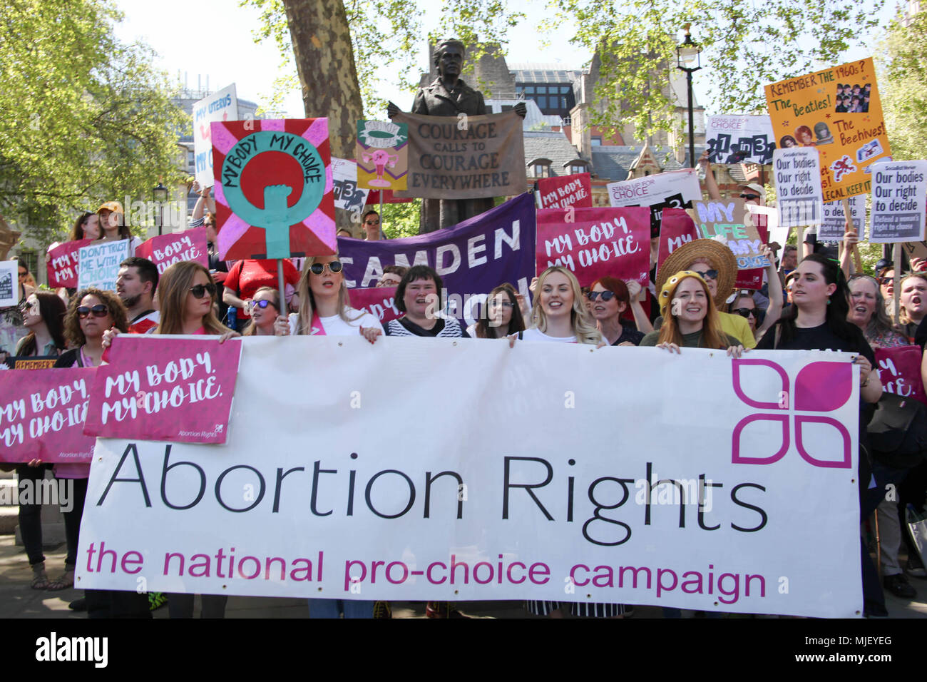 London, UK. 5th May, 2018. Pro-choice demonstrators pose next to statue ...