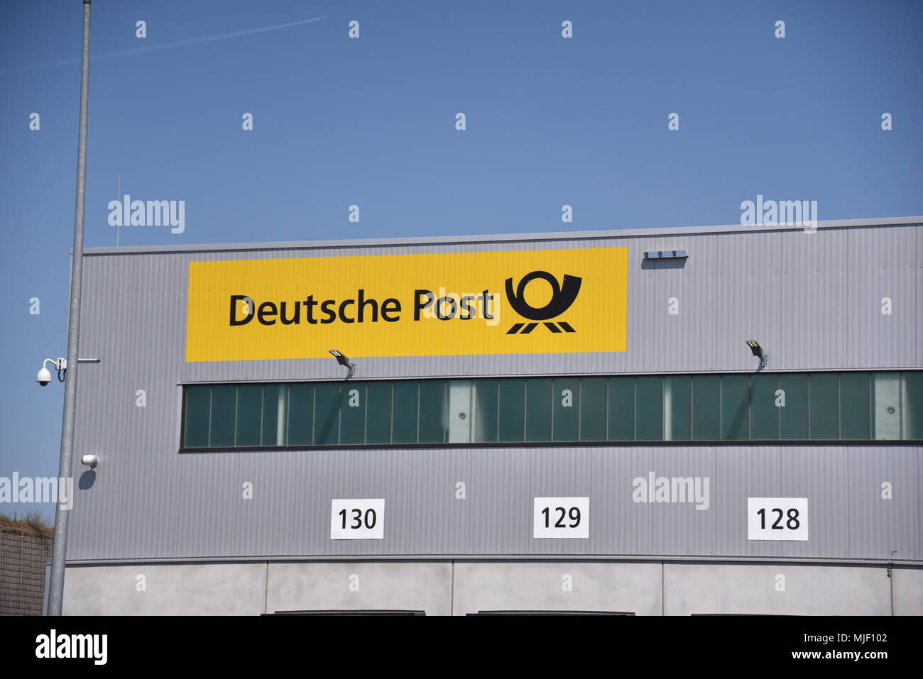 04 May 2018, Germany, Cologne: The logo of German postal service ...