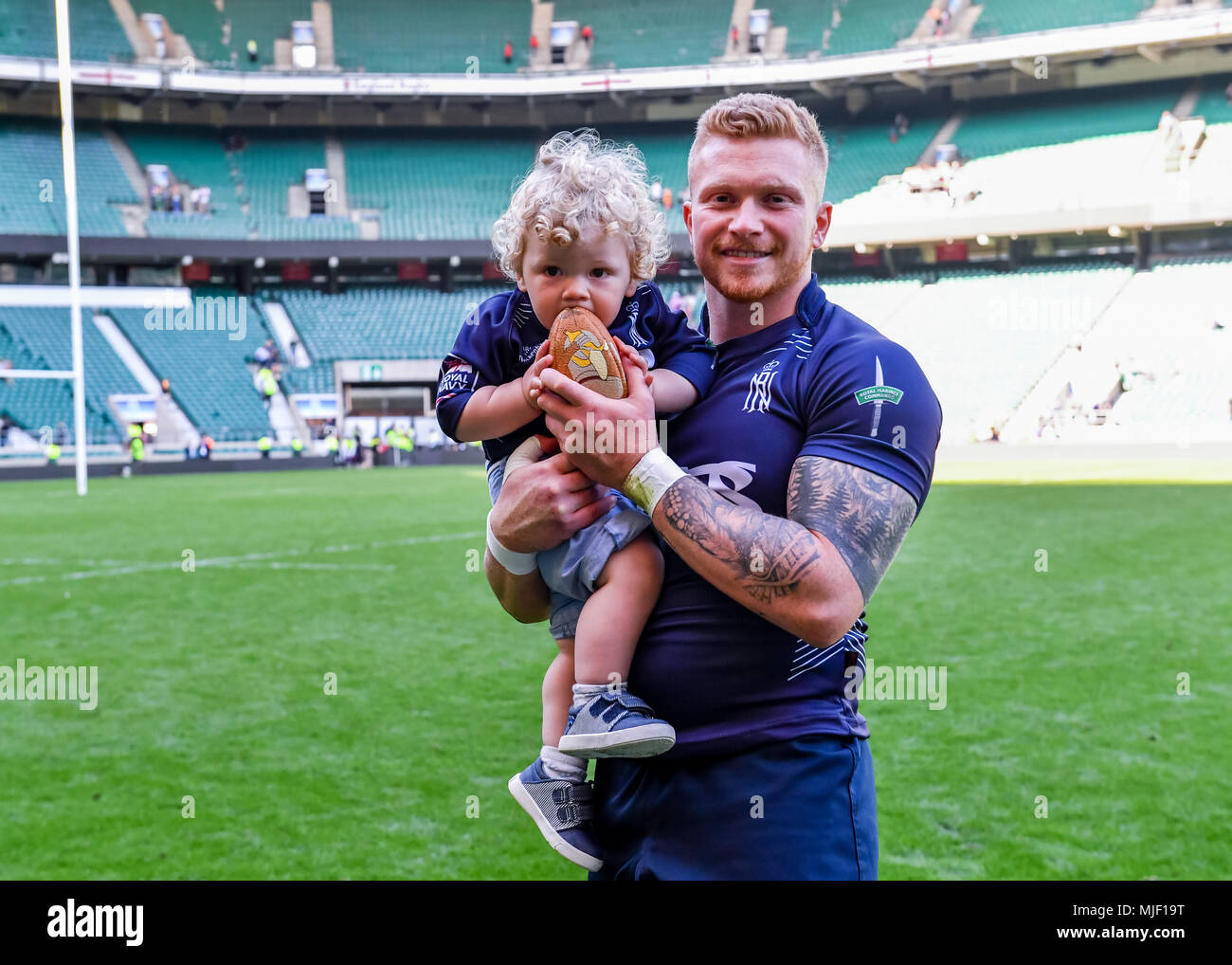 ET(ME) Sam Davies of Navy and his son pose photo for the media during ...