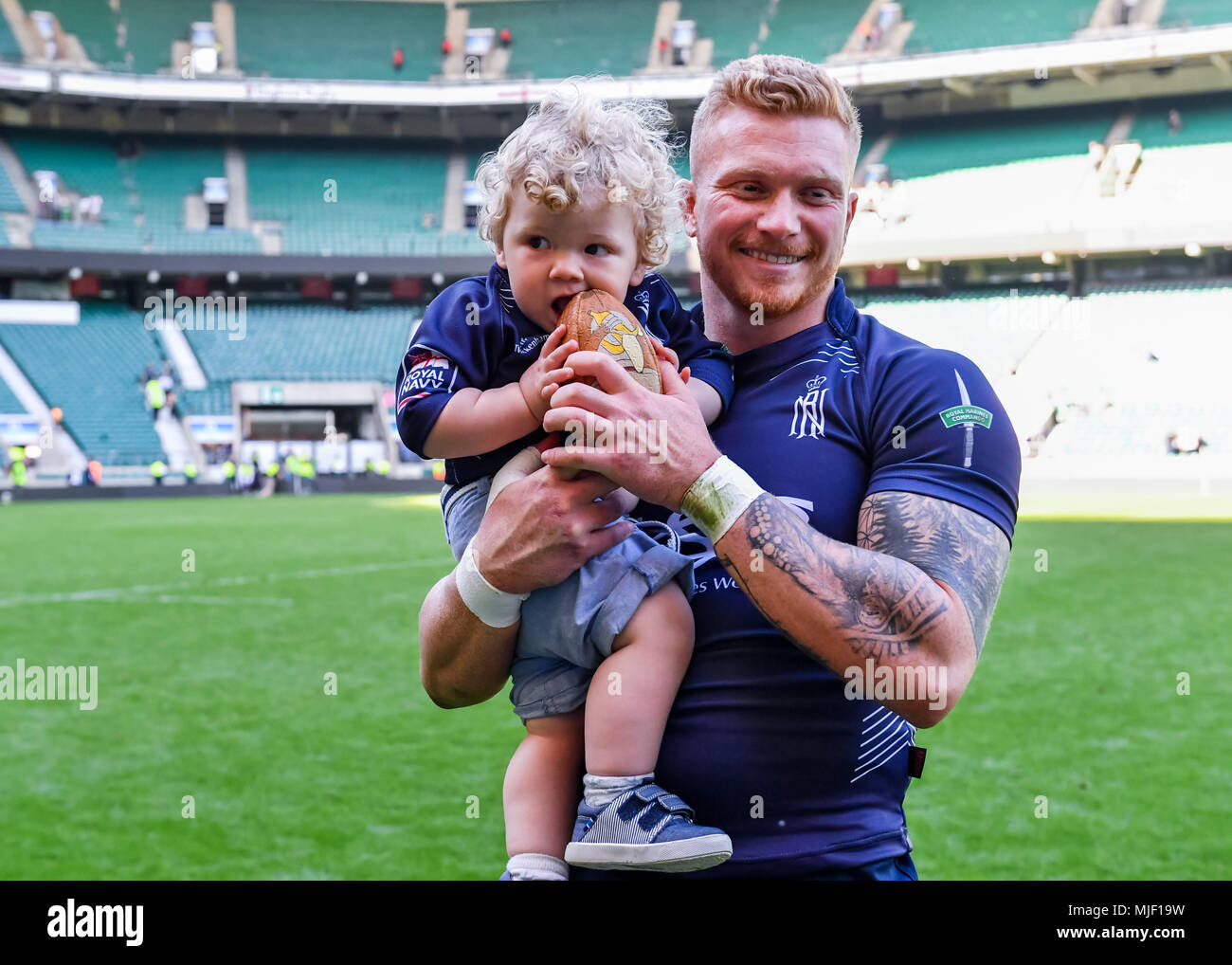 ET(ME) Sam Davies of Navy and his son pose photo for the media during ...