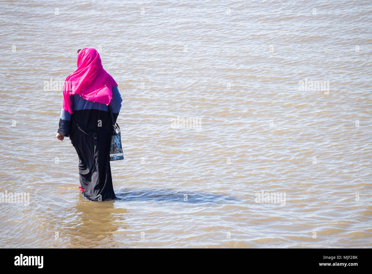 Muslim woman wearing hijab on beach hi-res stock photography and images ...
