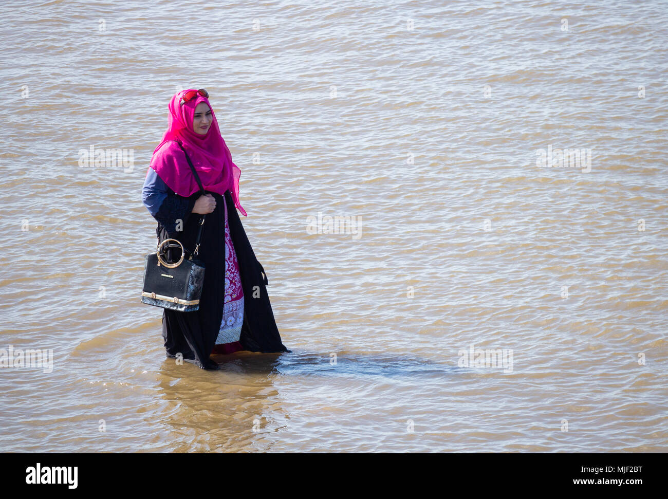 Muslim woman wearing hijab on beach hi-res stock photography and images ...
