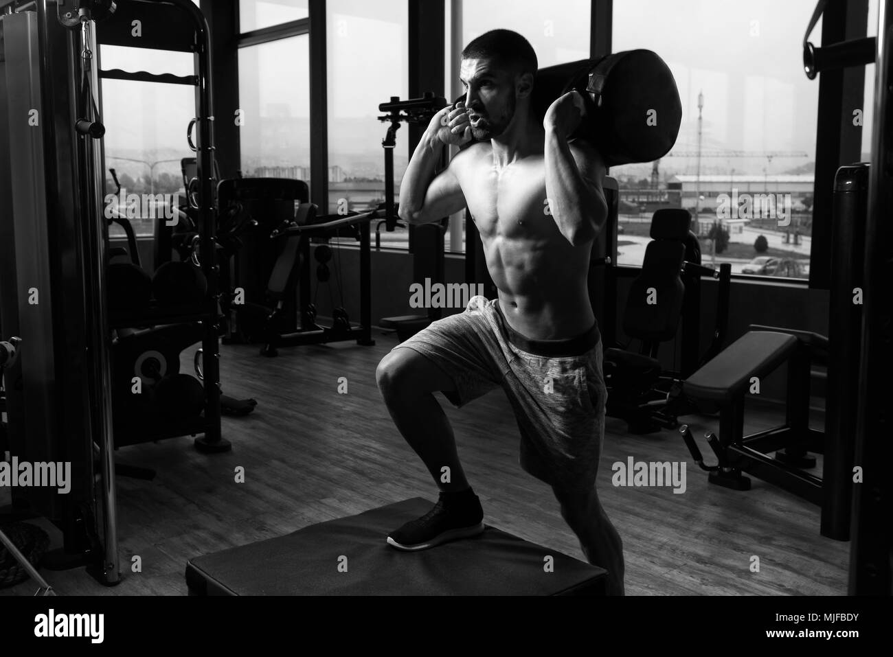 Fit Young Man Doing Box Jumping At A Style Gym - Male Athlete Is ...