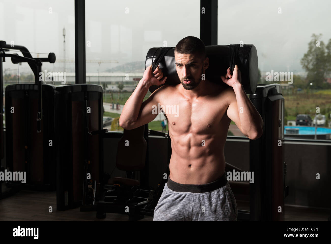 Fit Young Man Doing Box Jumping At A Style Gym - Male Athlete Is ...