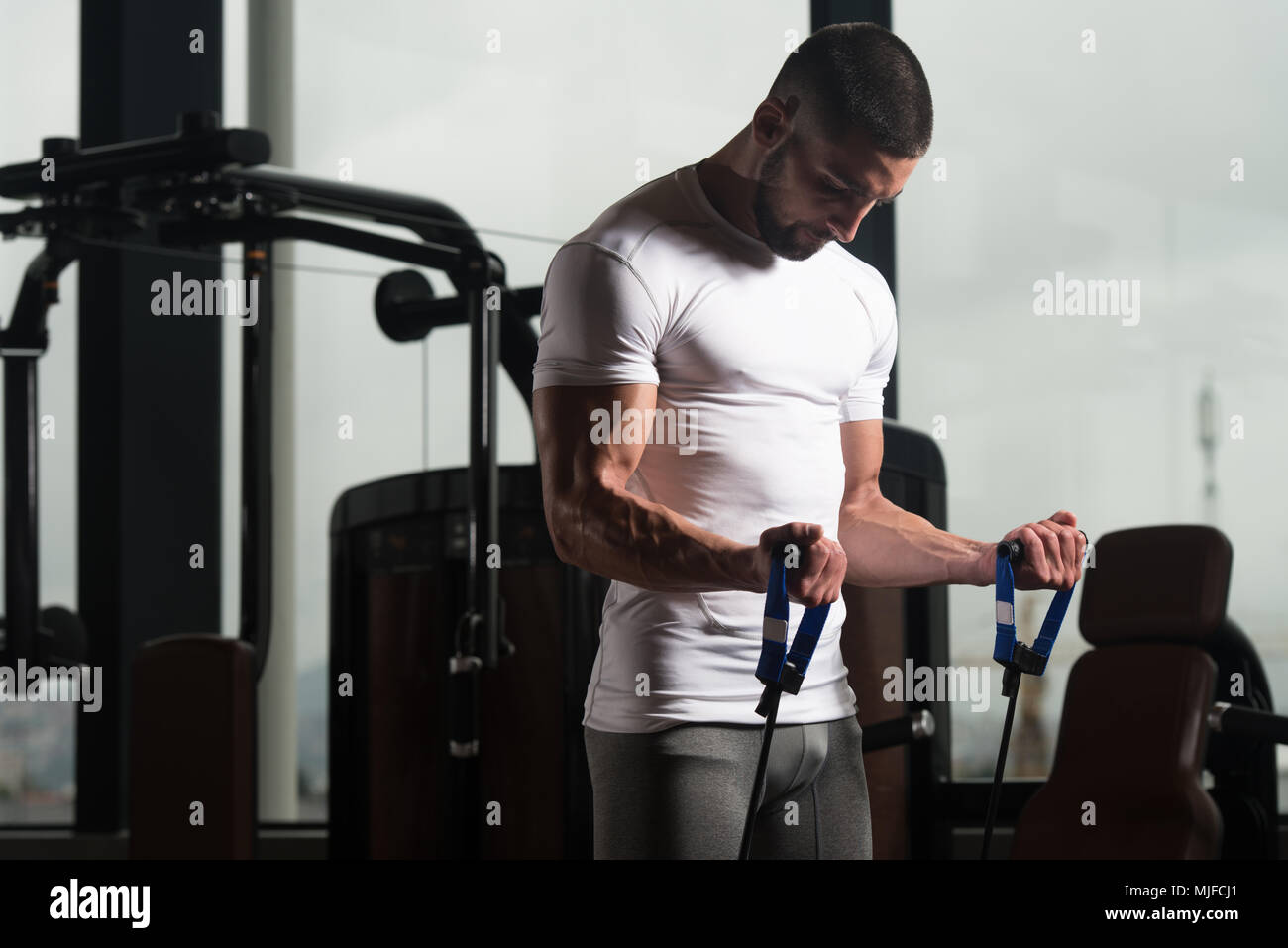 Young man exercising elastic hi-res stock photography and images - Alamy