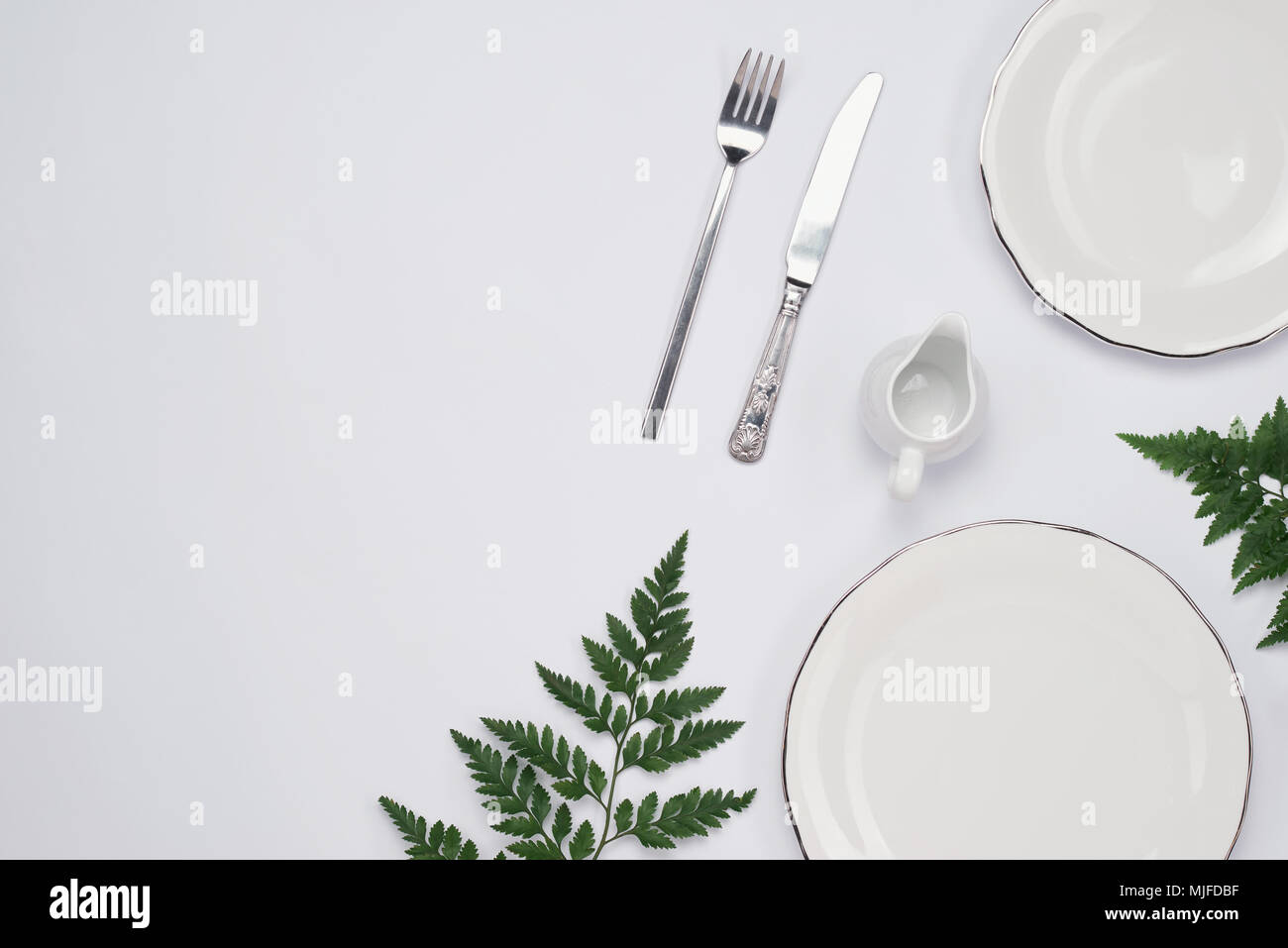 Ceramic plates on white background. Top view Stock Photo - Alamy