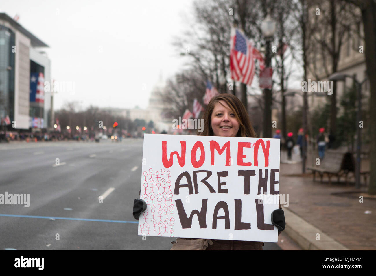 Kelli Stiles of Columbus, Ohio carries a protest sign during the Women ...