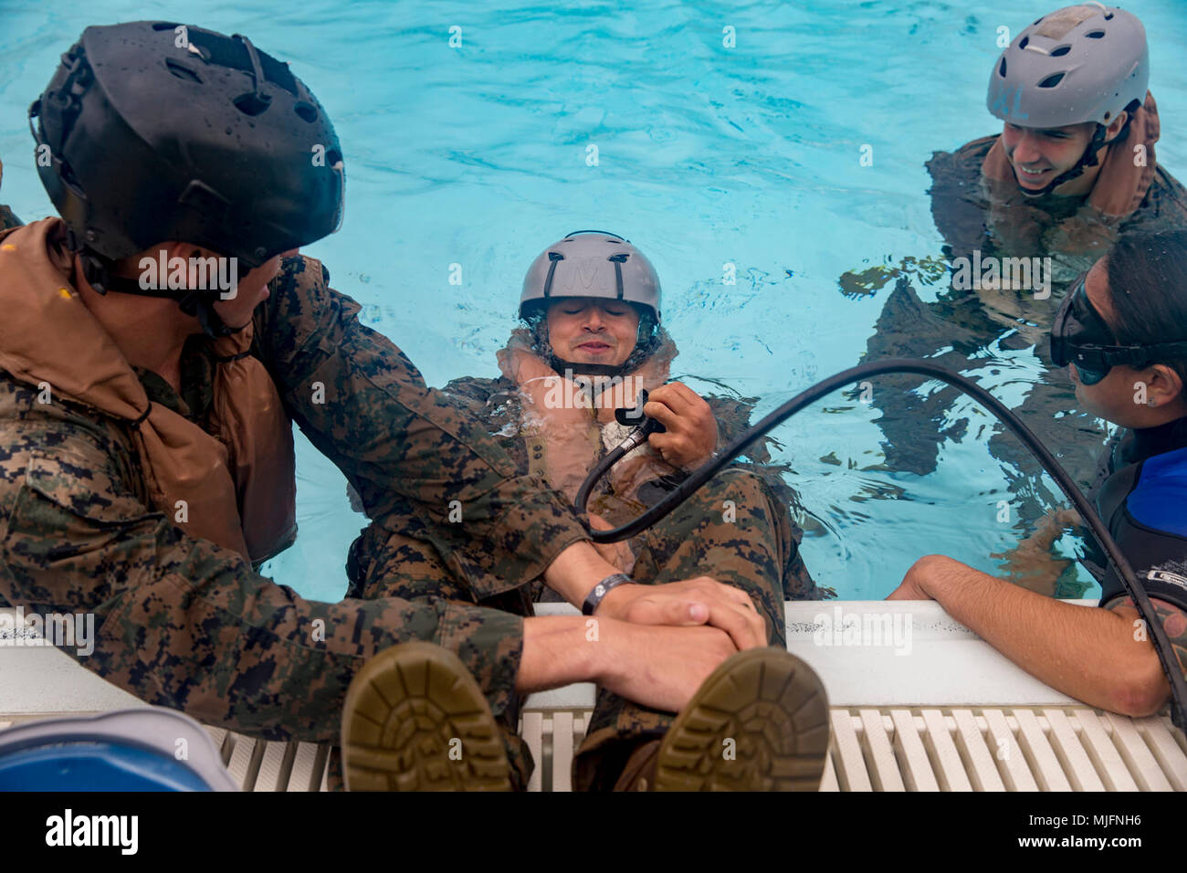 U.S. Marine Lance Cpl. Robert Stotts holds his breath to practice using ...