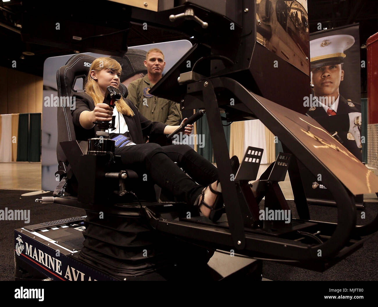 RENO, Nevada — Capt. Joshua Herm assists Mary “Kate” Rourke, a student ...