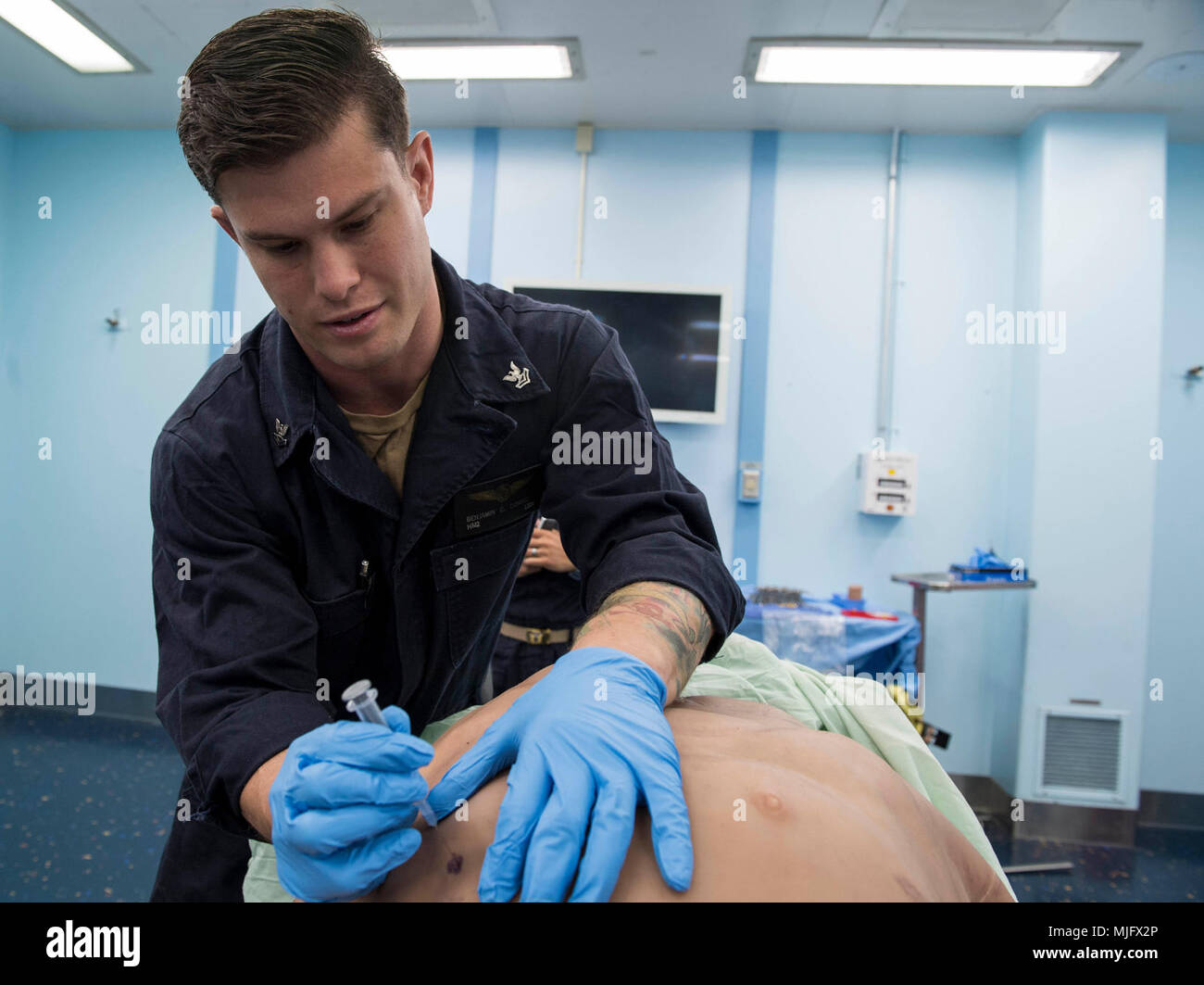 OCEAN (March 23, 2018) Hospital Corpsman 2nd Class Ben Donelly, from ...