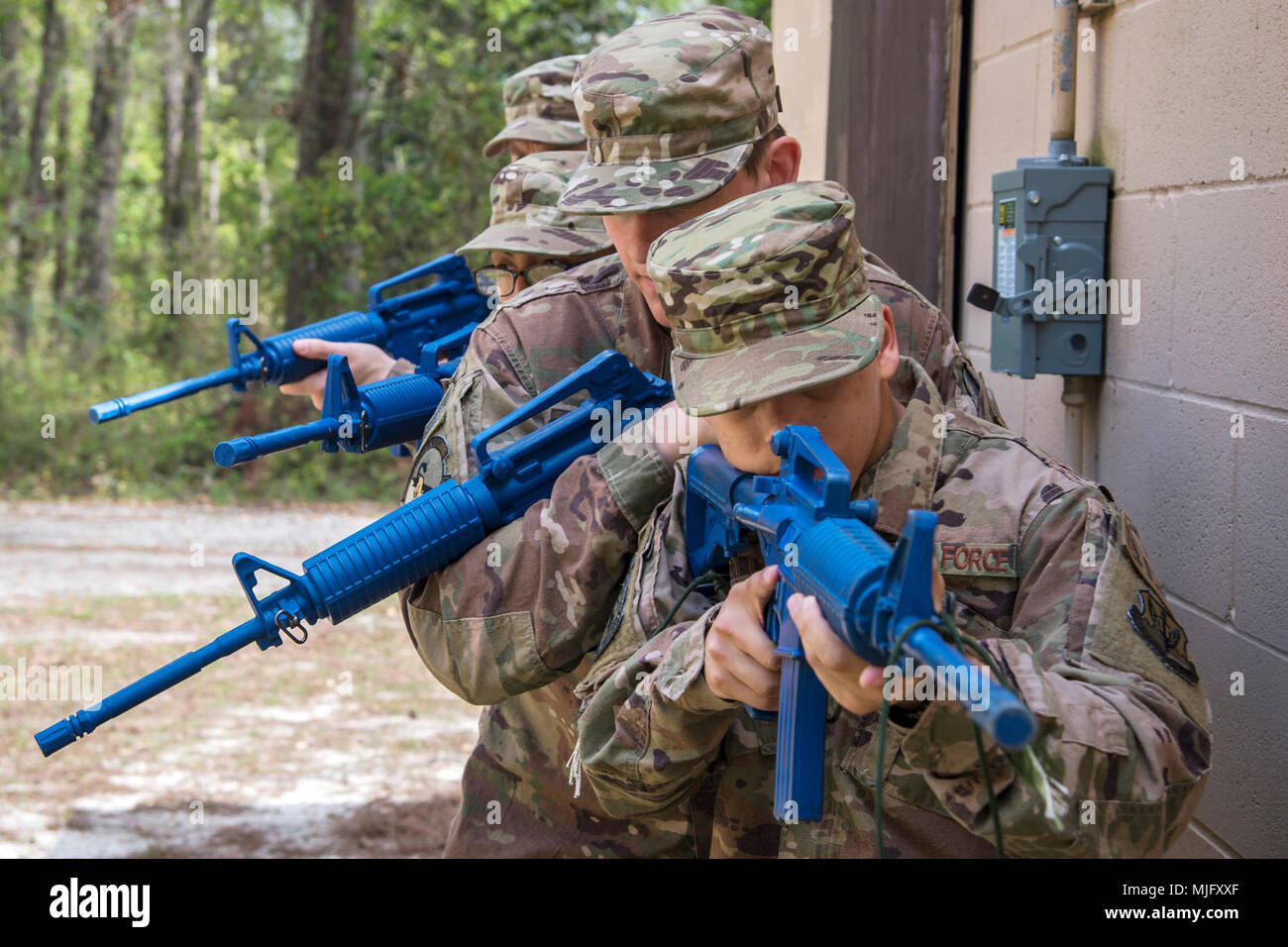Airmen from the 820th Base Defense Group (BDG) prepare to advance their ...