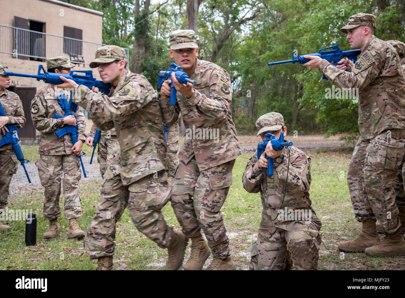 Airmen from the 820th Base Defense Group (BDG) secure their position ...