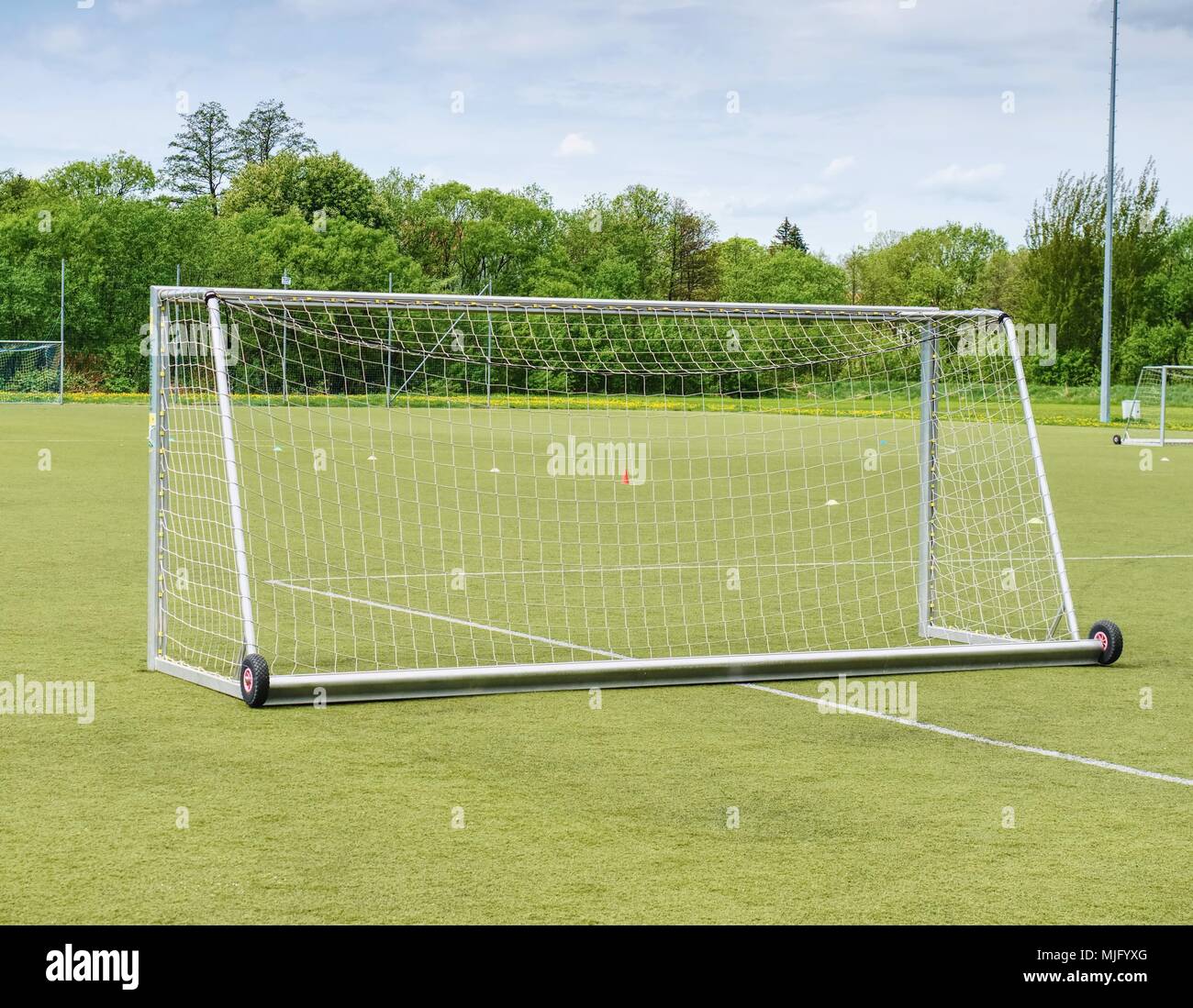 Football playground. Gate with blue yellow nets, soccer football net ...