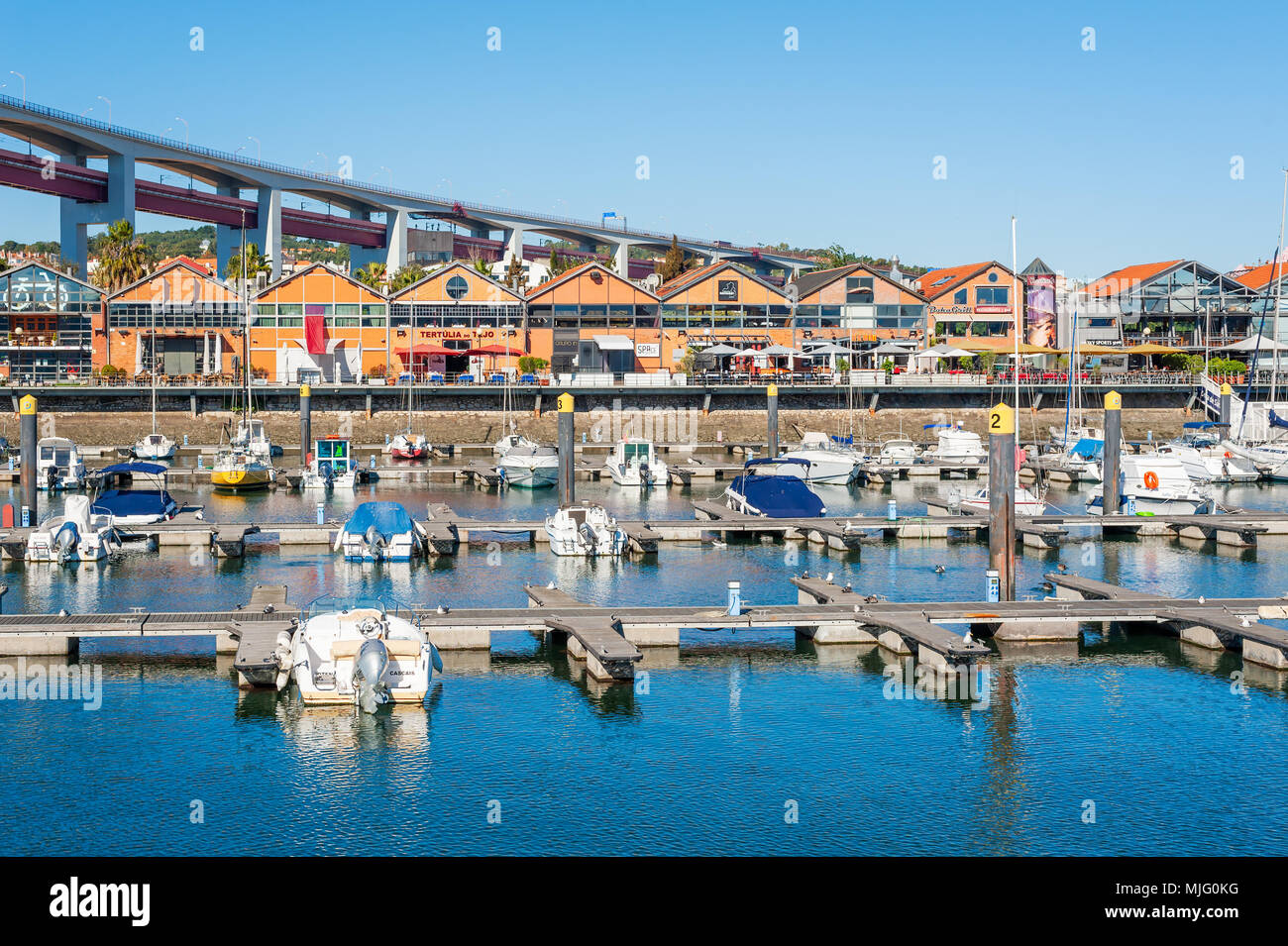 Lisbon, Portugal - Nov 26, 2013 : Santo Amaro docks with 24th april ...