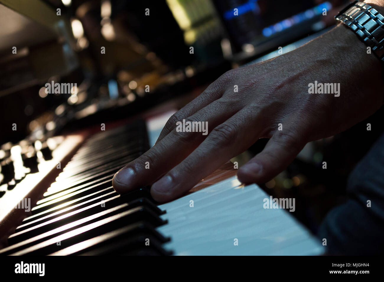 Piano Keyboards In Music Studio And A Hand Of A Musician Stock Photo ...