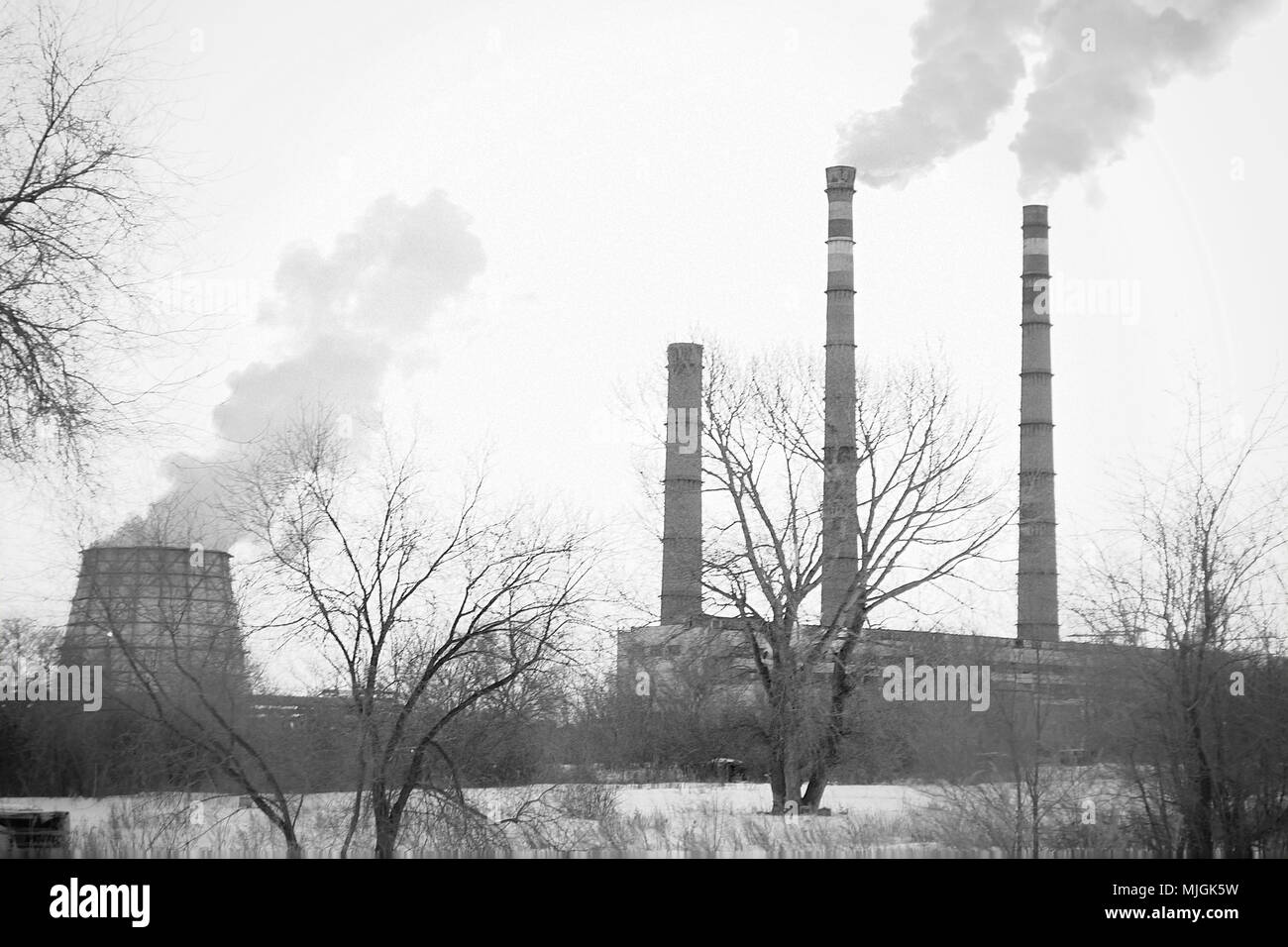 Smoke from chimney factory sunset Black and White Stock Photos & Images ...