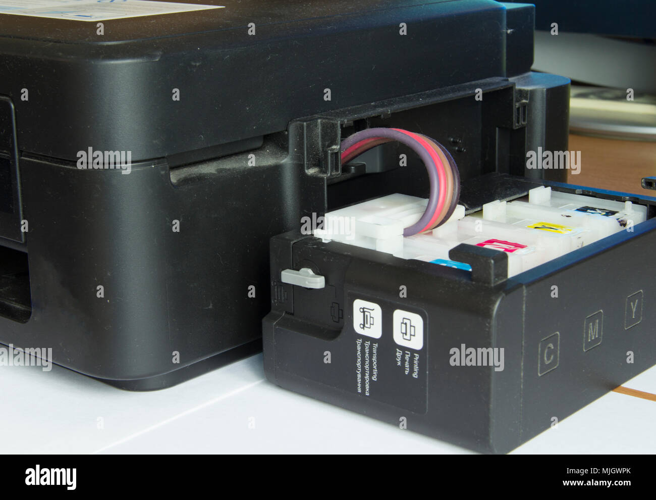 Ink-tank color printer ready to refill with paint Stock Photo - Alamy