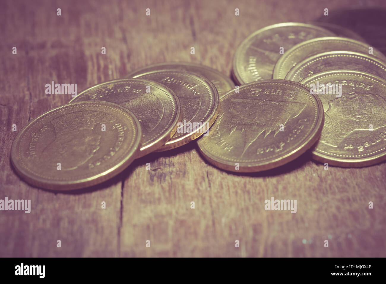 coins on wood with filter effect retro vintage style Stock Photo - Alamy