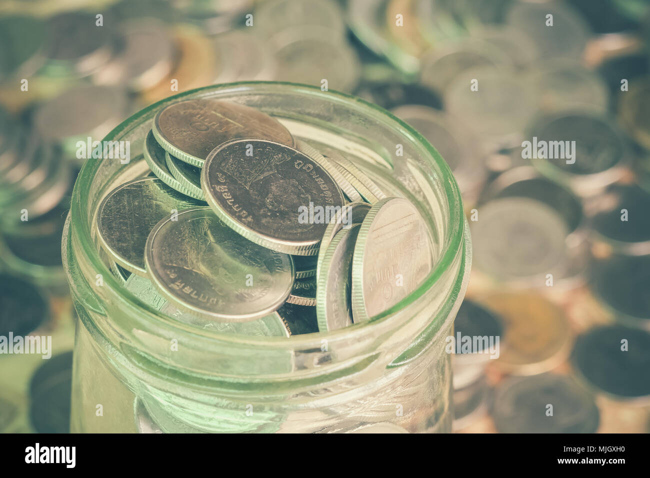 money in the glass with filter effect retro vintage style Stock Photo ...