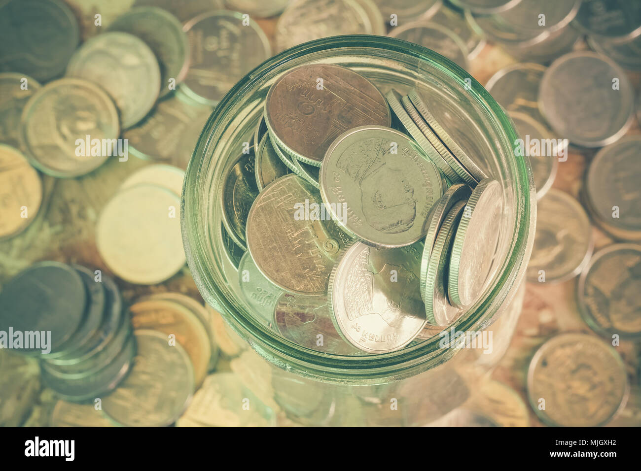 money in the glass with filter effect retro vintage style Stock Photo ...