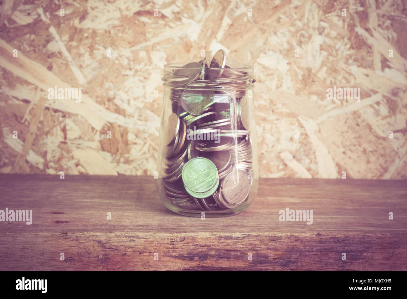 money in the glass with filter effect retro vintage style Stock Photo ...