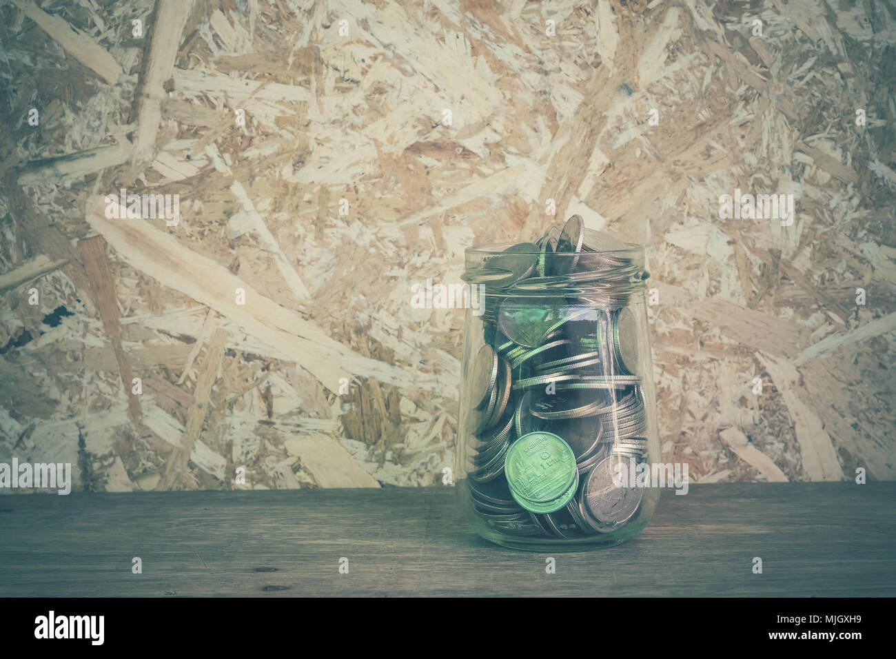 money in the glass with filter effect retro vintage style Stock Photo ...