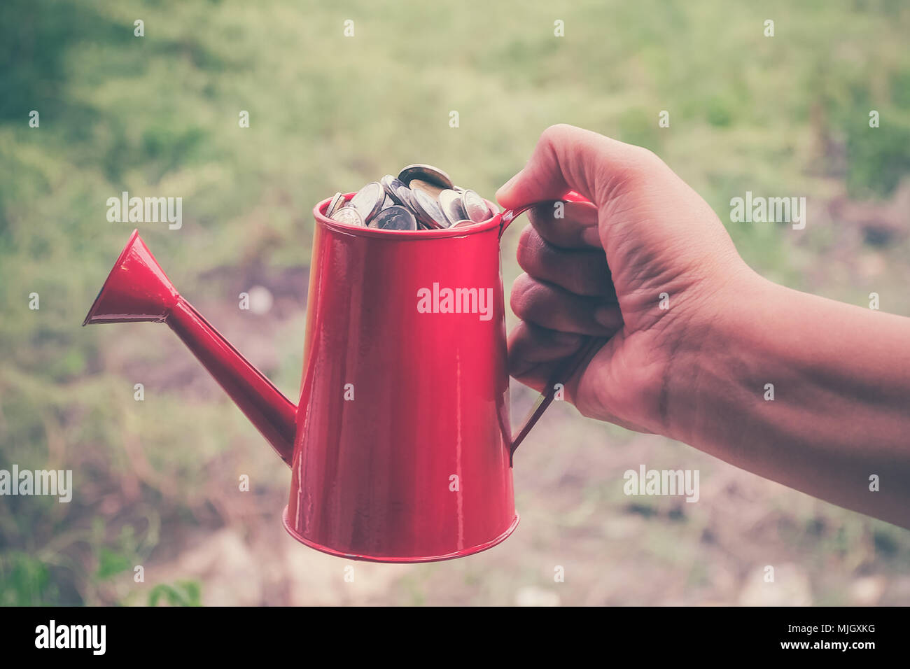 coin in red Watering-Can with filter effect retro vintage style Stock ...
