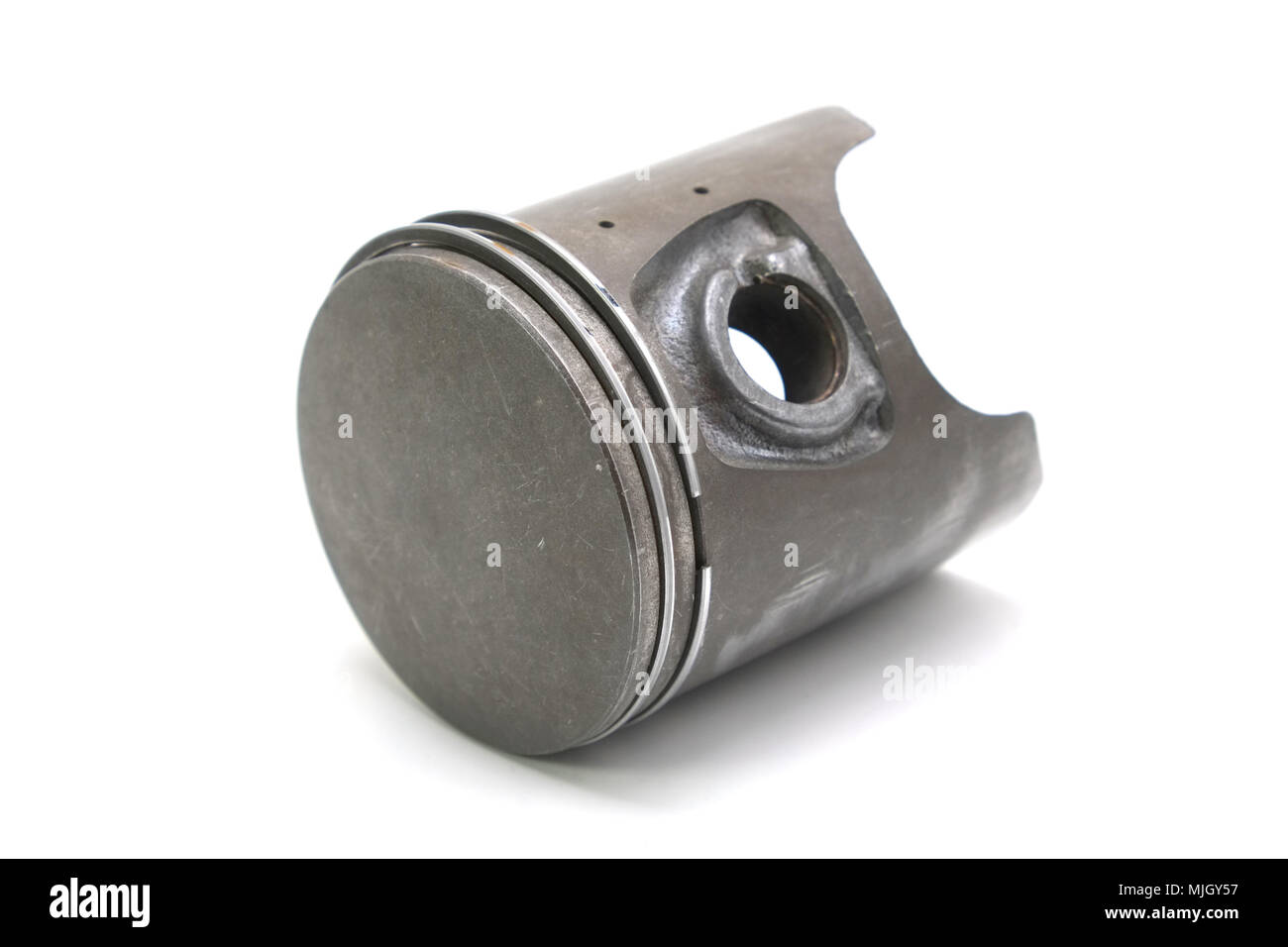 Old engine piston isolated on white background Stock Photo - Alamy