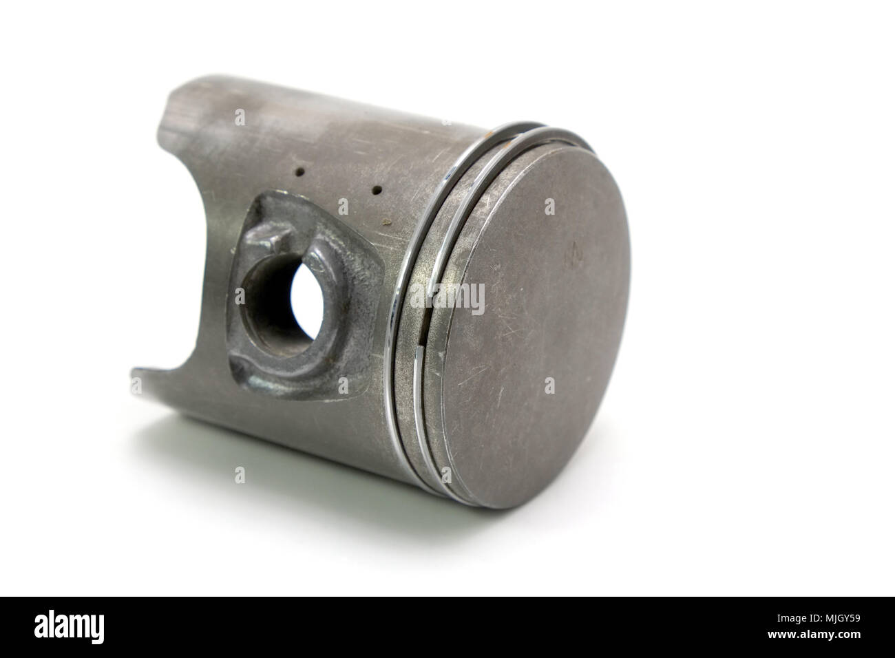 Old engine piston isolated on white background Stock Photo - Alamy